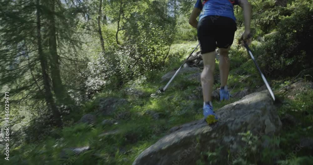 caucasian trail runner running in mountain through woods, villages. 4k ...
