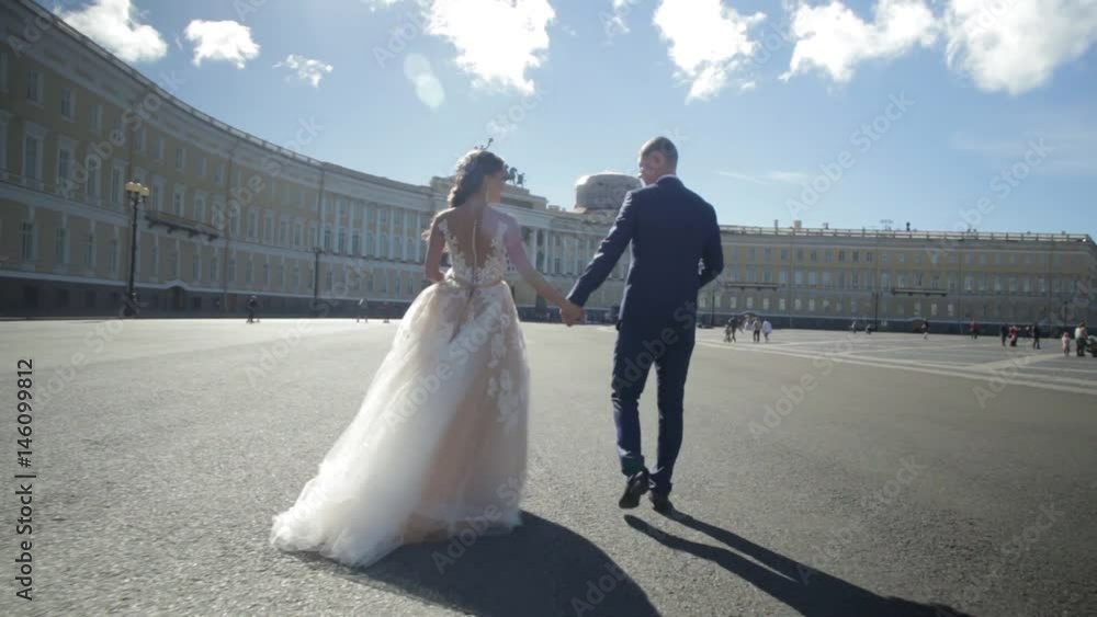 St Petersburg, Russia Bride and groom walking along. the bride and ...
