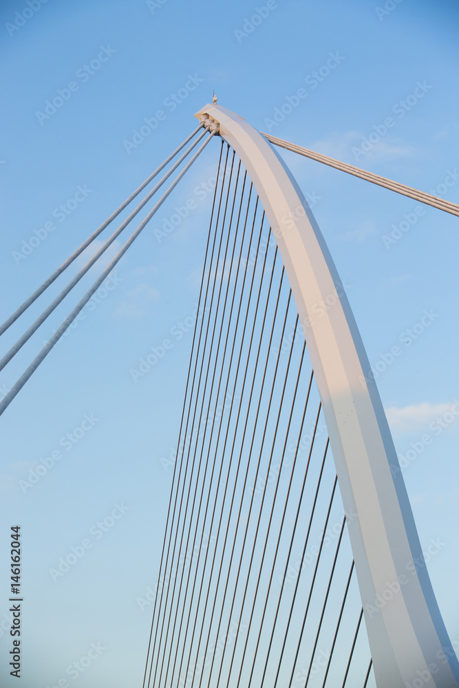 The Samuel Beckett Bridge crosses the Liffey River in Dublin. The ...