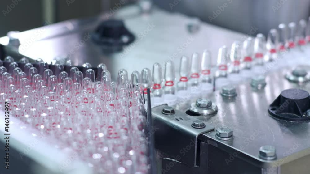 Pharmaceutical production line at pharma factory. Drug manufacturing ...