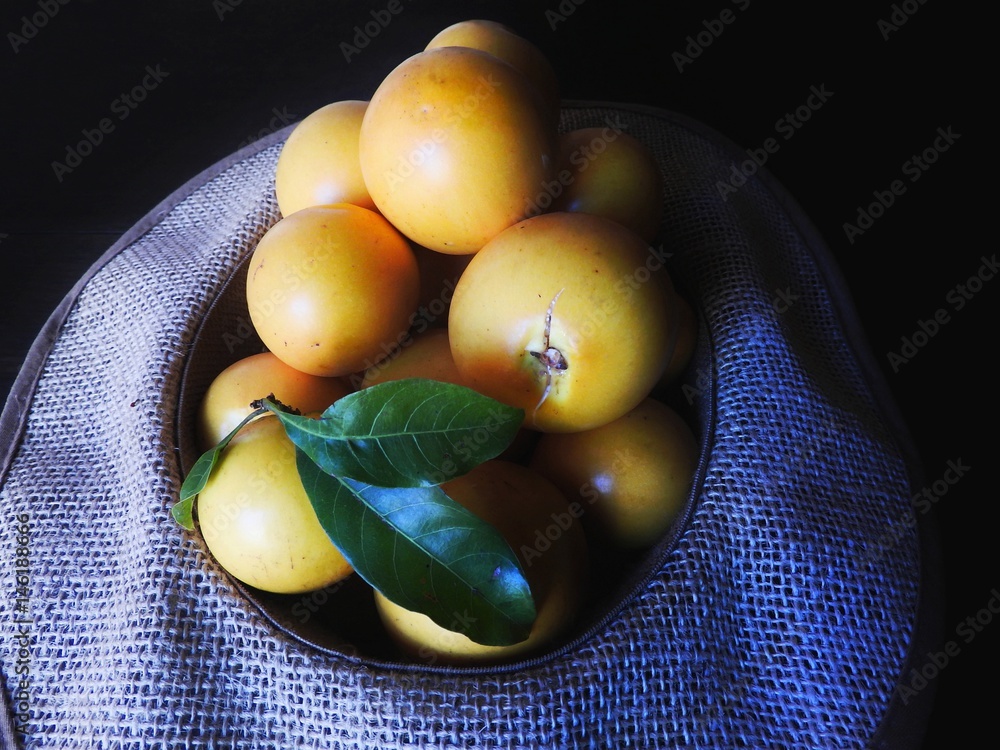 Close Abiu yellow exotic fruit inside the natural fiber sub exposure ...