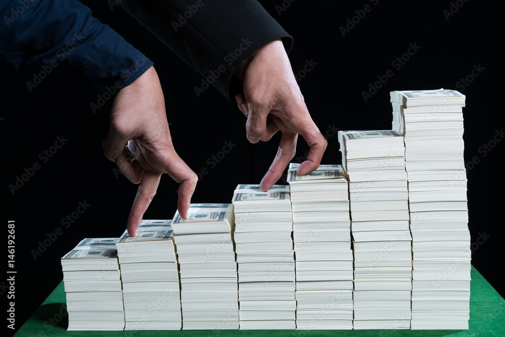 Two hand used fingers are competing in step action walking on pile of ...