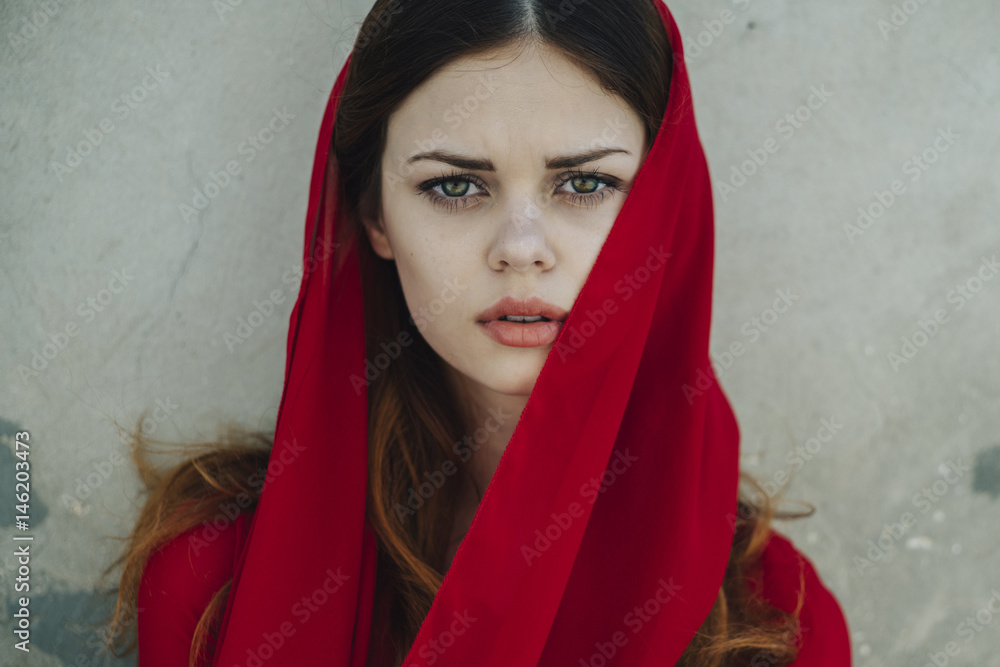 Serious Caucasian woman wearing red headscarf Stock-Foto | Adobe Stock