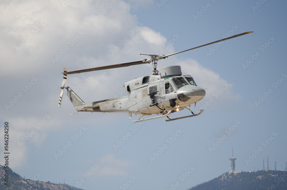 Helicopter bell uh 1 approach landing. right machine gun view. mountain ...