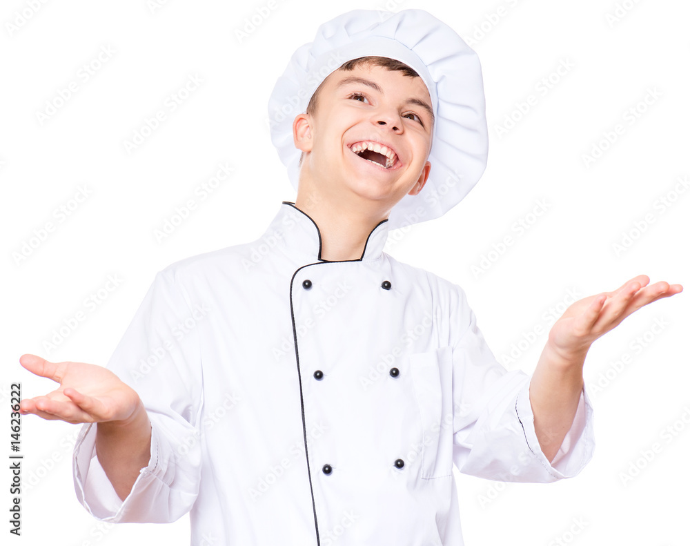 Cheerful handsome teen boy wearing chef uniform. Portrait of a happy ...