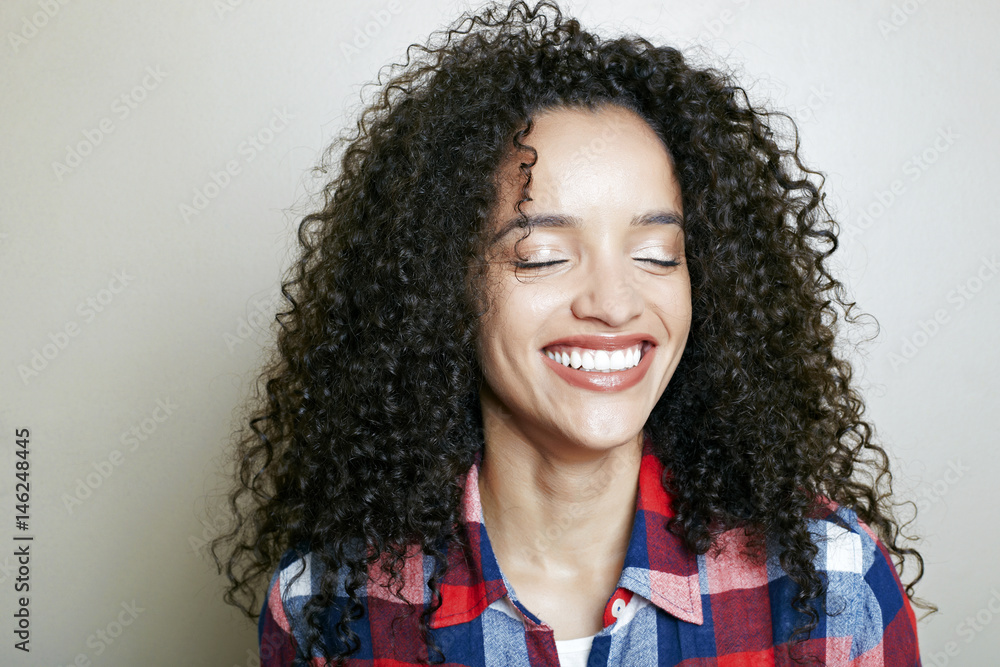 Hispanic woman laughing Stock Photo | Adobe Stock