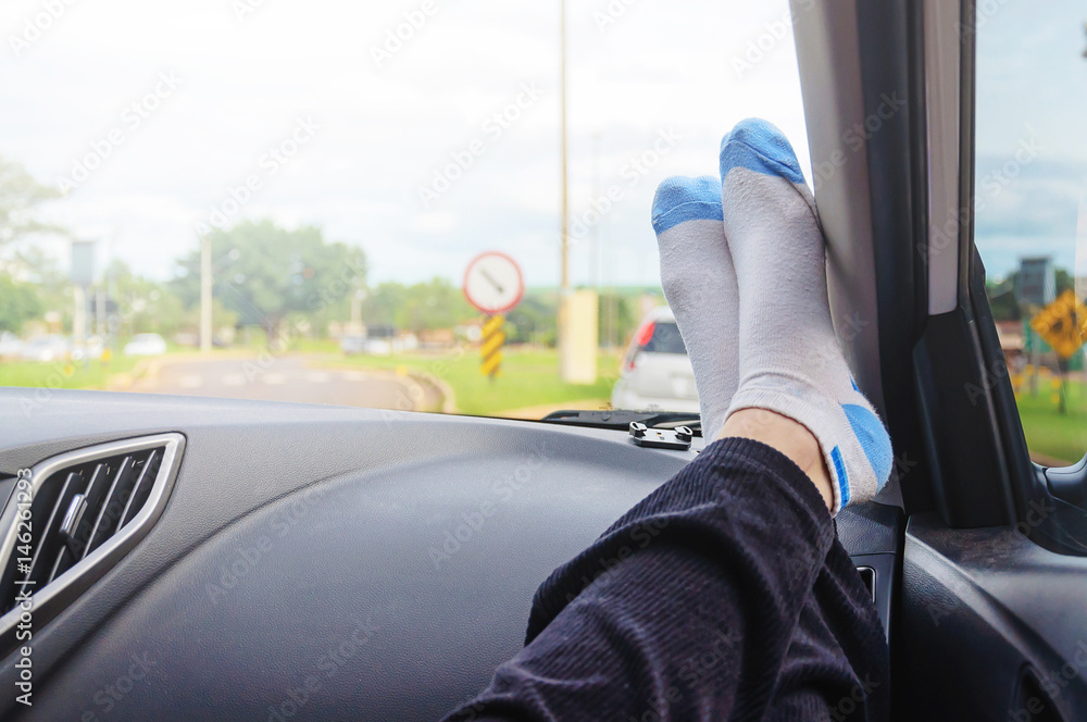 Girl foot over a car dashboard Stock Photo | Adobe Stock