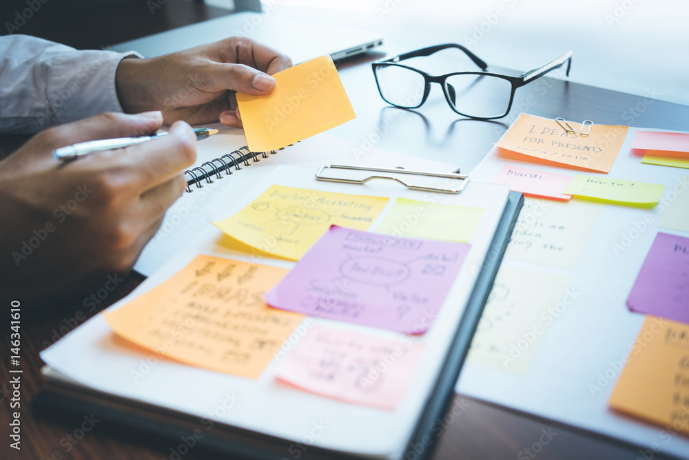 Businessman working with note paper for brainstorming ideas.strategy ...