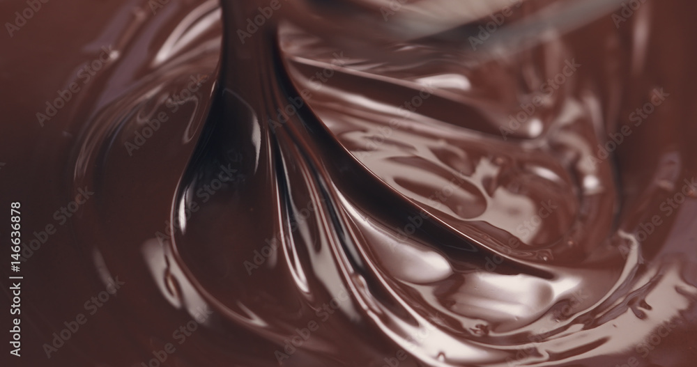 mixing melted premium dark chocolate with a whisk toned, 4k photo Stock ...