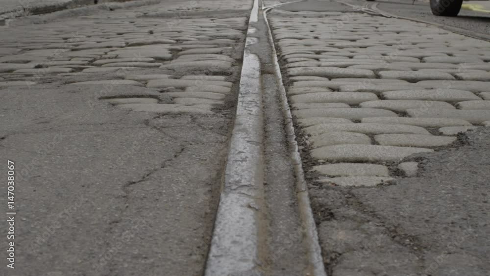 Cobblestone road with old train track Stock Video | Adobe Stock