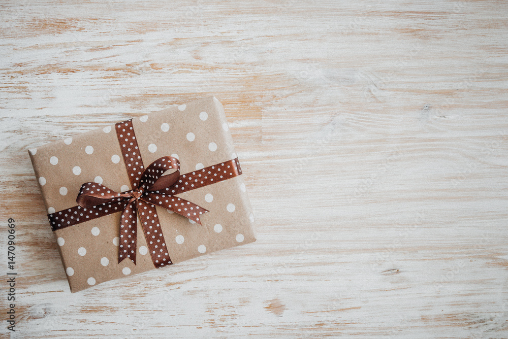 Box in craft paper, eco paper on the wooden table. Top view. Brown ...
