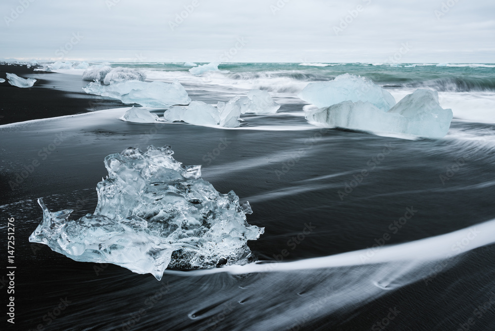 Ice on the beach with black sand in Iceland Stock Photo | Adobe Stock