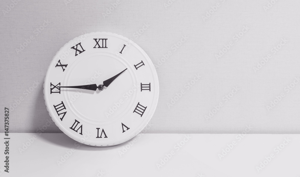 Closeup white clock for decorate show a quarter to two o'clock or 1:45 ...