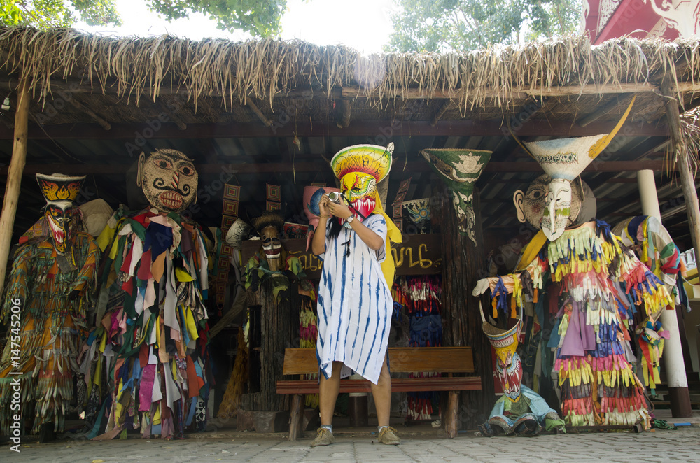 Asian thai woman wearing mask head with costume of Phi Ta Khon dance ...