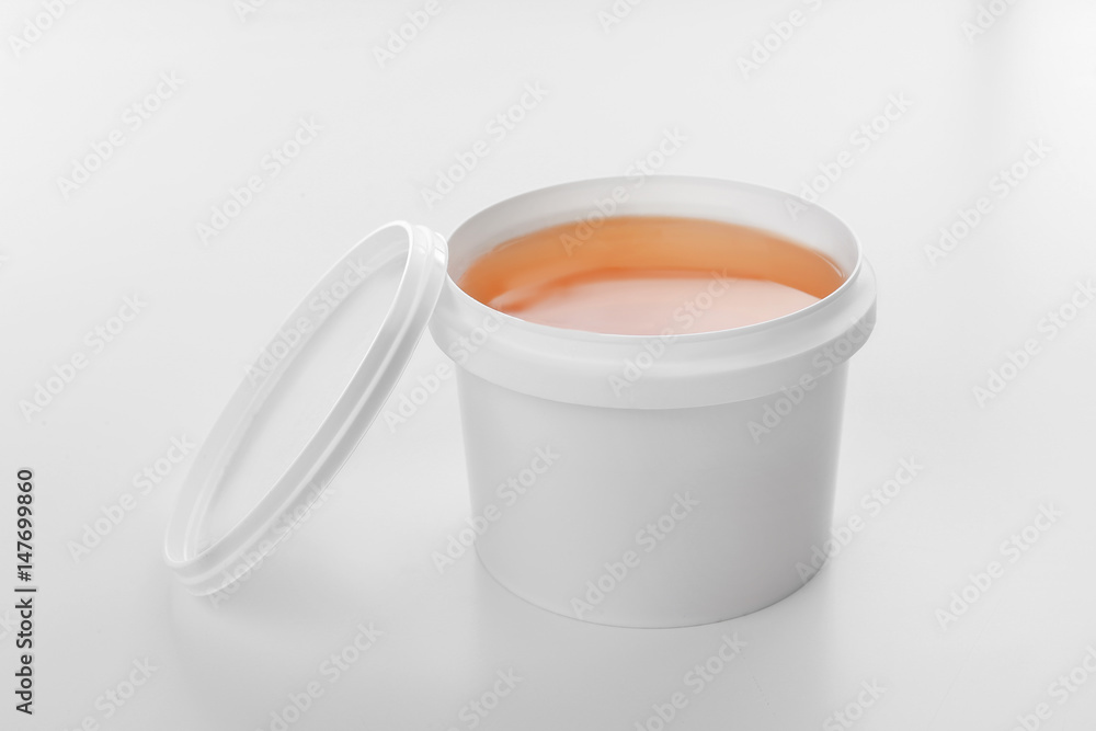 Plastic bucket with sugaring paste on white background Stock Photo ... Plastic bucket with sugaring paste on white background Stock Photo ...