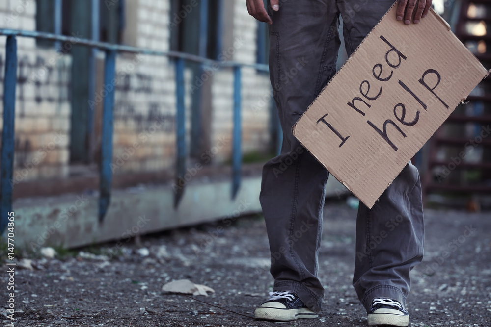Poor man begging for help on the street Stock Photo | Adobe Stock