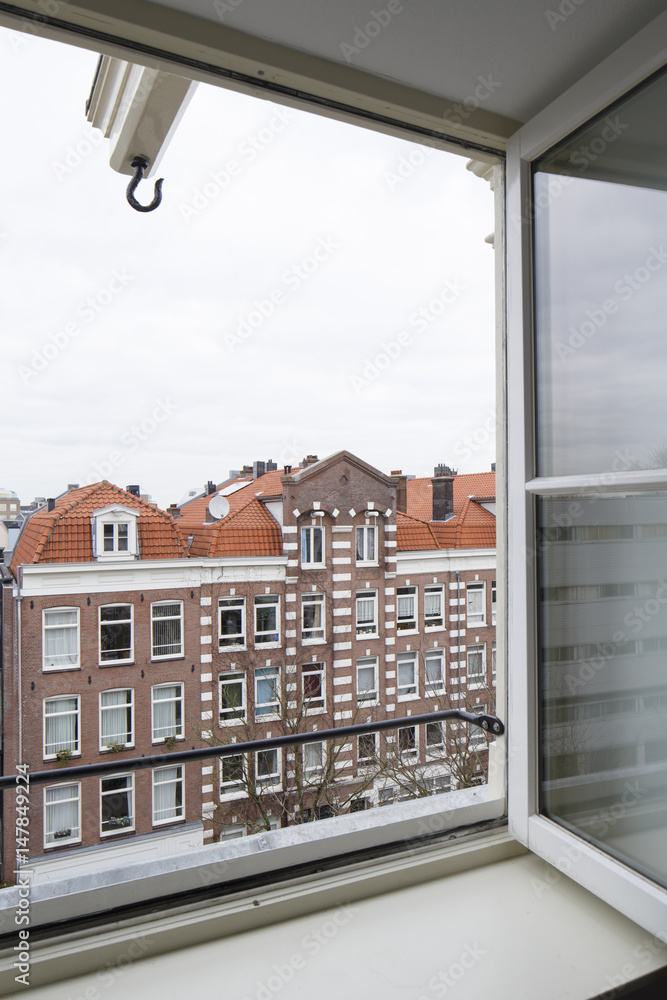 facades of houses in amsterdam seen from a window across the street ...