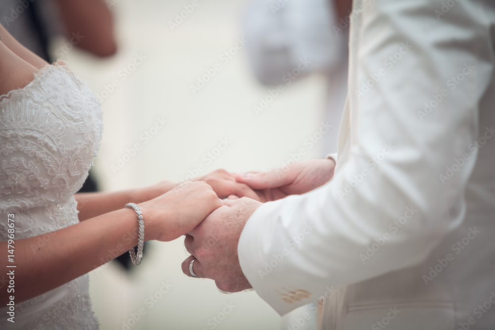 Wedding couple holding hands on sunset background.Soft focus Stock ...