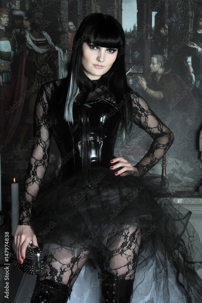 Foto de pretty young gothic girl wearing black pvc and lace clothes ...