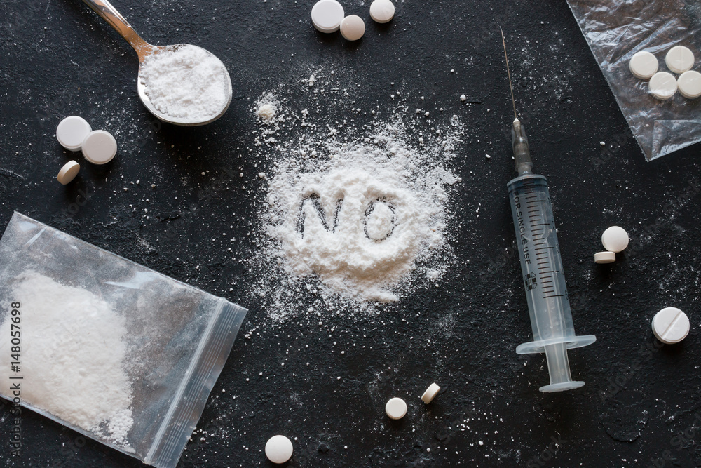 Different drugs, syringe and the inscription "no" - concept stop drug ...
