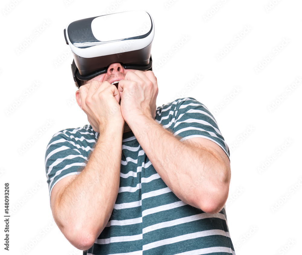 Amazed man wearing virtual reality goggles watching movies, isolated on ...