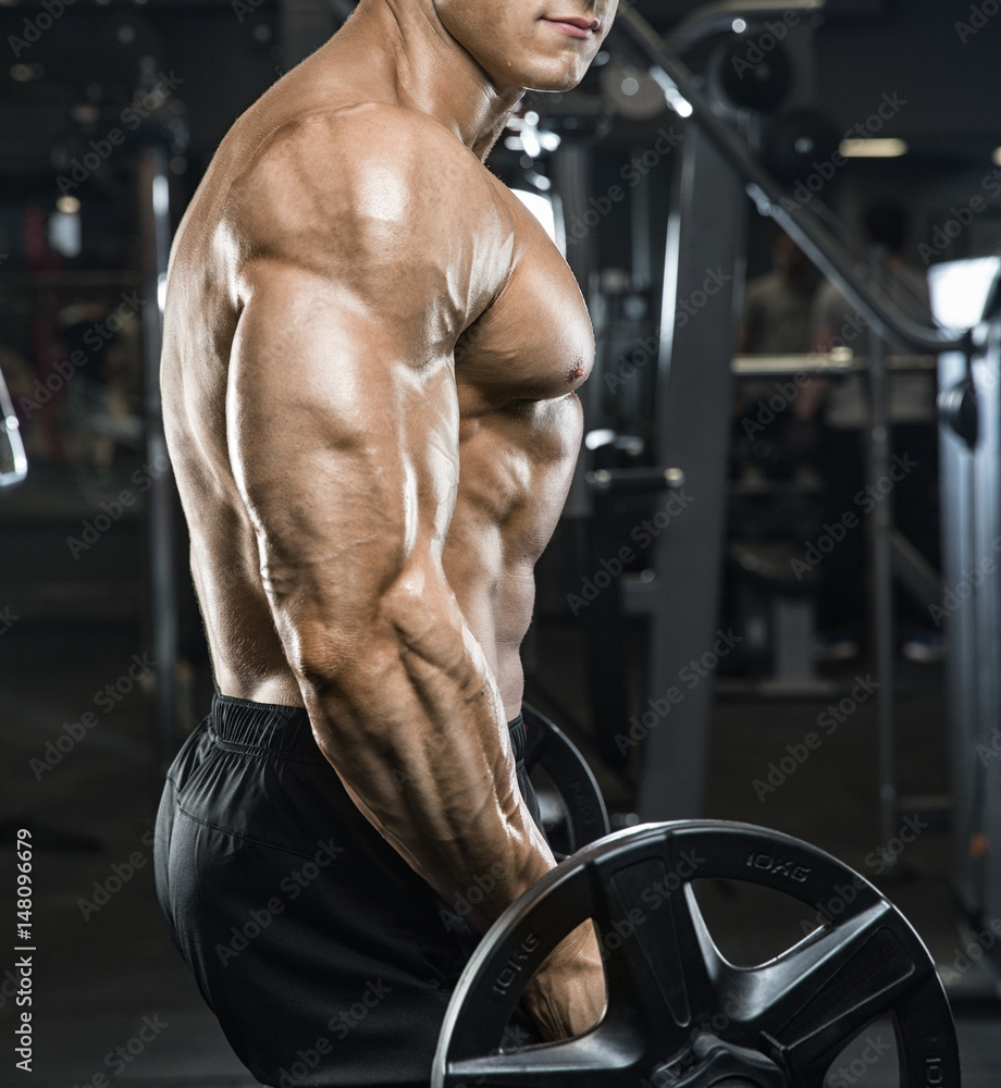 Brutal strong athletic men pumping up muscles workout bodybuilding ...