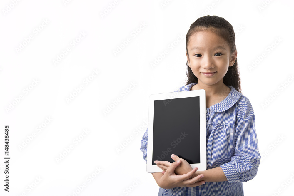 Little asian girl smiling and showing computer tablet screen isolate on ...