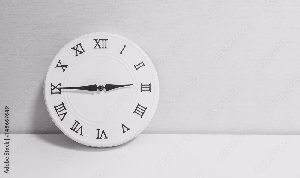 Closeup white clock for decorate show a quarter to three o'clock or 2: ...