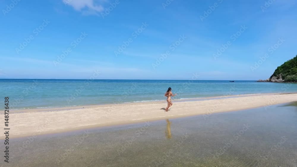 Young Carefree Happy Tanned Girl in Bikini Running on Sandy Spit Beach ...