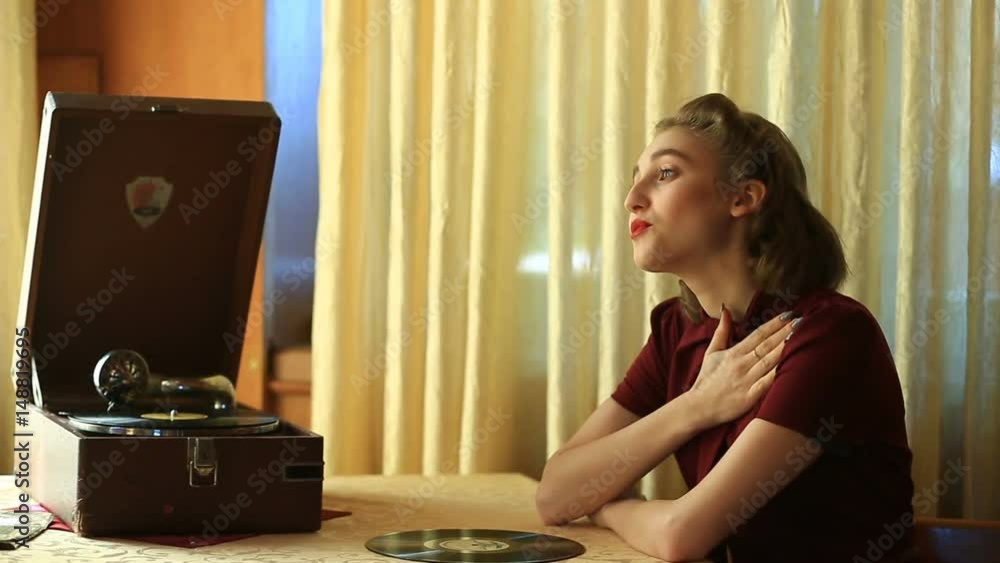 Happy pin-up girl in a retro style dress. Girl with positive emotions ...