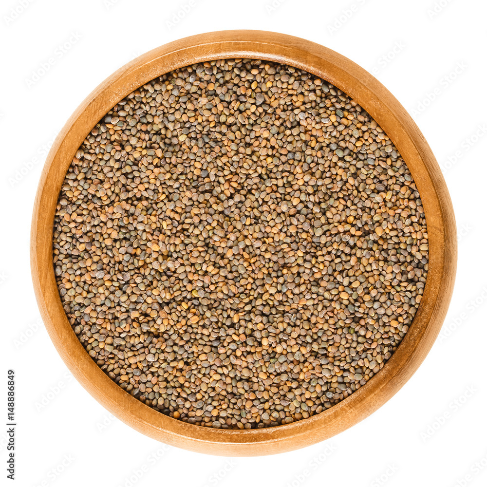 Wild rocket seeds in wooden bowl. Diplotaxis tenuifolia, also perennial ...