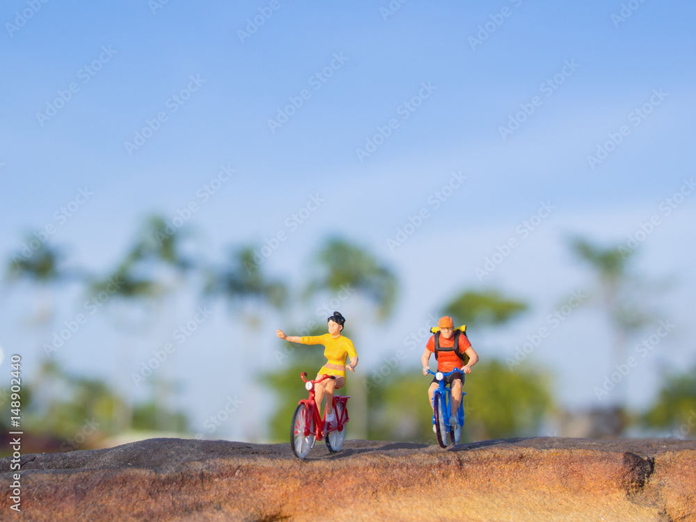 mini figure toys ride bicycle outdoor on the sunny day Stock Photo ...