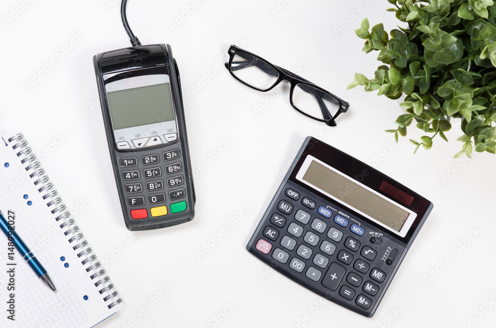 Office desk table with payment terminal and calculator Stock Photo ...