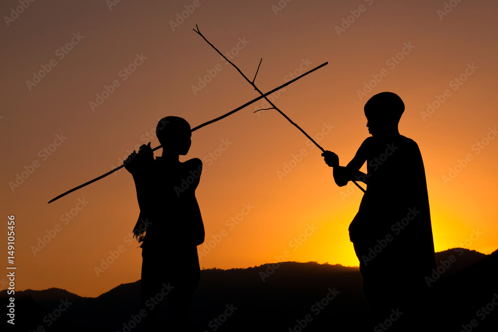 Two young boys of the Surmi tribe practicing stick fighting, Omo Valley ...