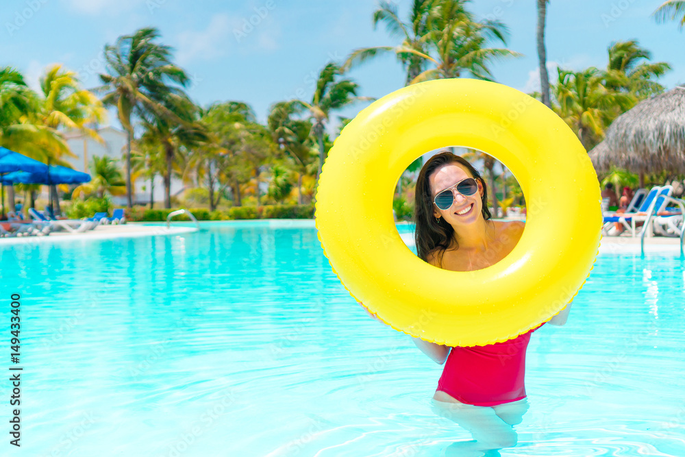 Beautiful young woman relaxing in swimming pool. Girl in outdoor pool ...