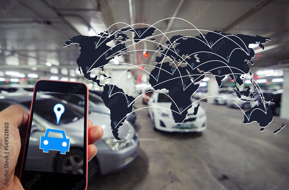 hand holding smart phone with car symbol and world map global ...