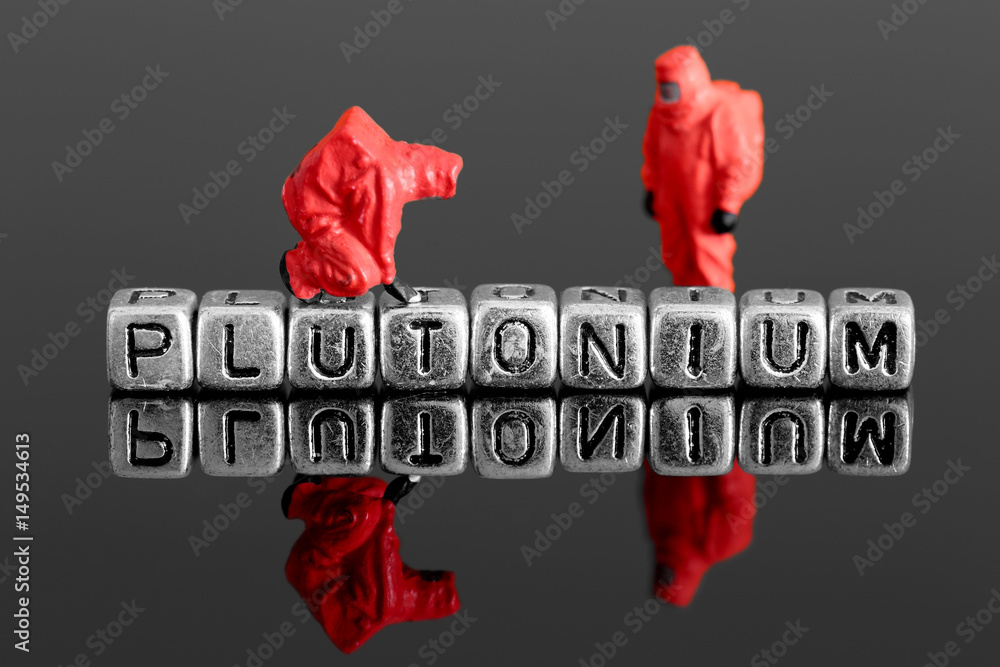Miniature scale model team in chemical suits with the word plutonium on ...