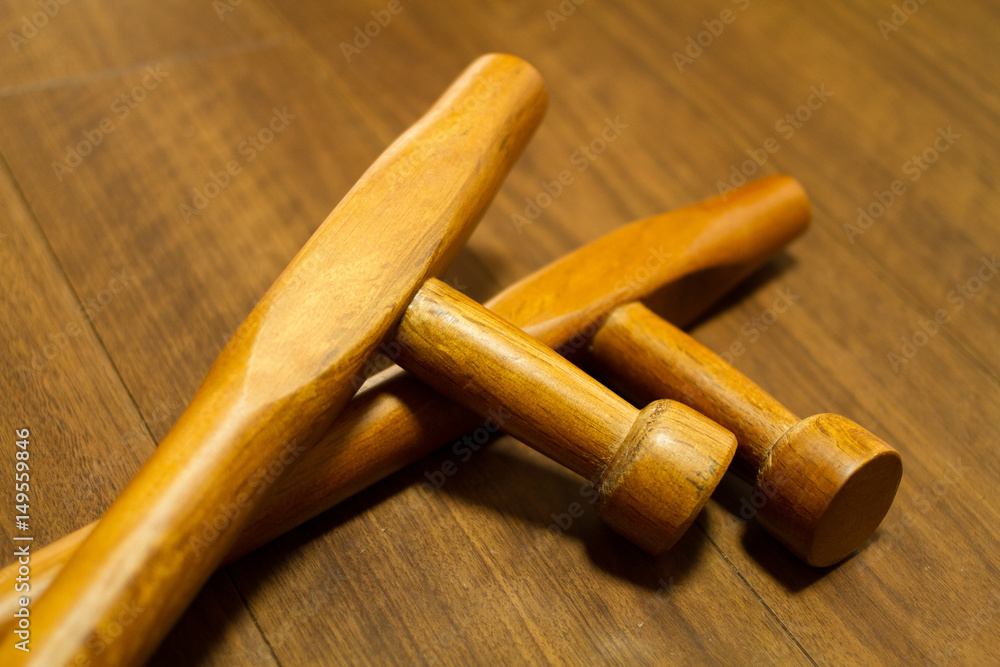 A pair of Tonfa ( traditional okinawan karate's weapon) on the floor ...