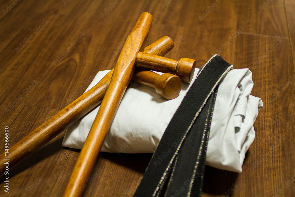 Tonfa ( traditional okinawan karate's weapon) , black belt and Gi ...