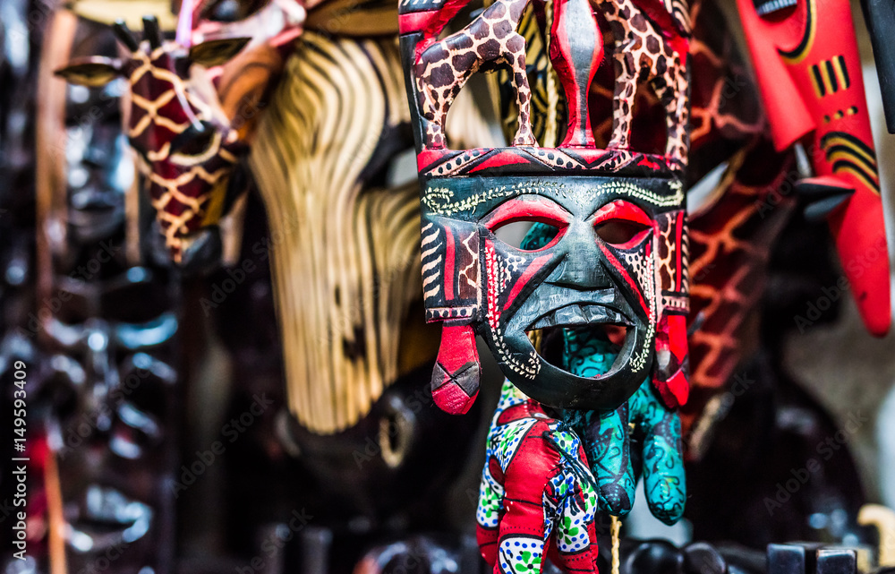 colorful traditional woodcarved tribal mask on african market Stock ...