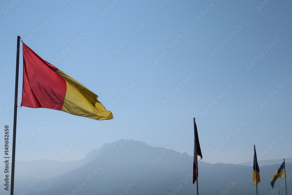 Drapeau rouge et jaune flottant à la Bastille Stock Photo | Adobe Stock