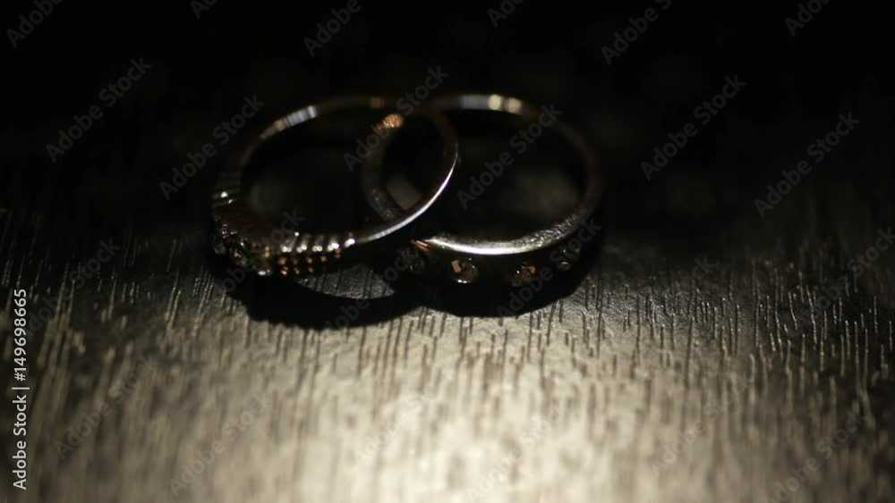 Two wedding gold rings and stars silhouettes Stock Video | Adobe Stock
