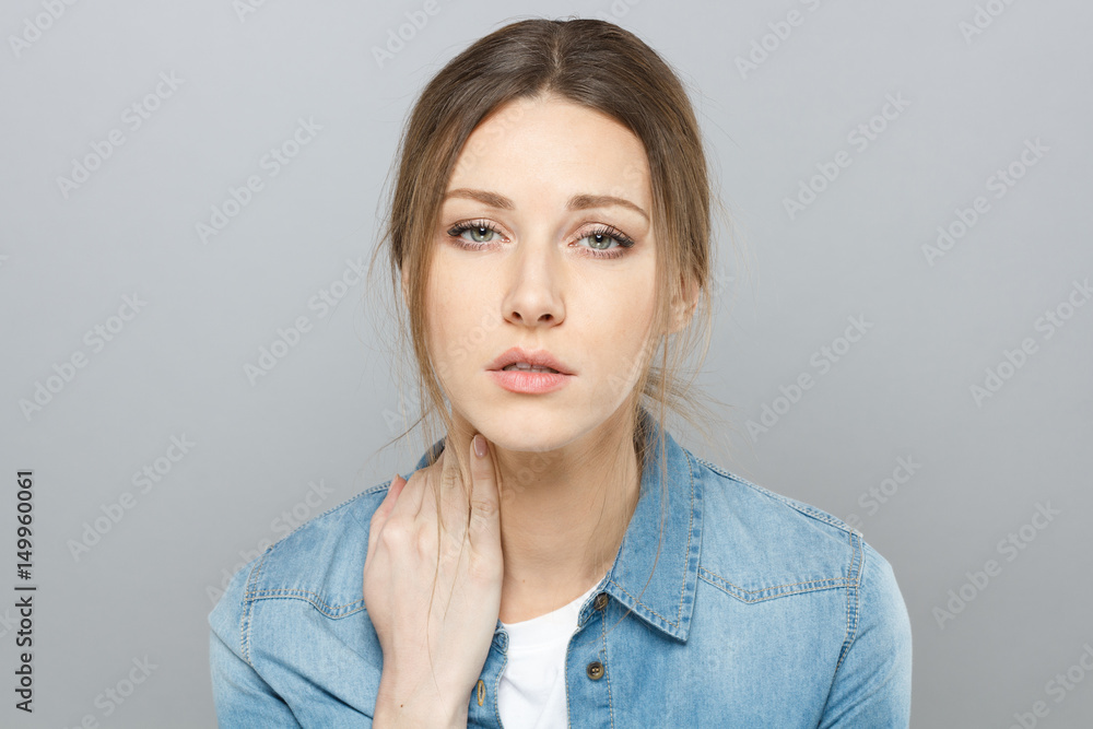 Picture of tired beautiful girl dressed casually isolated on gray ...