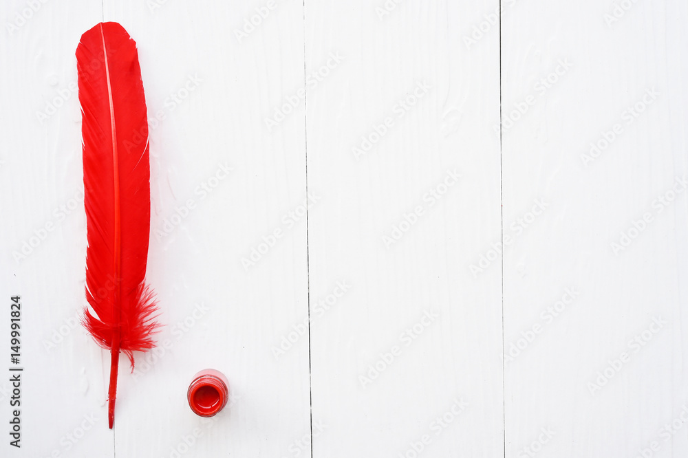 red feather and ink isolated on white background Stock Photo | Adobe Stock