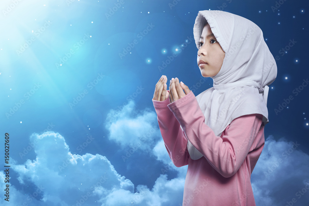 Little asian muslim kid in hijab pray Stock Photo | Adobe Stock