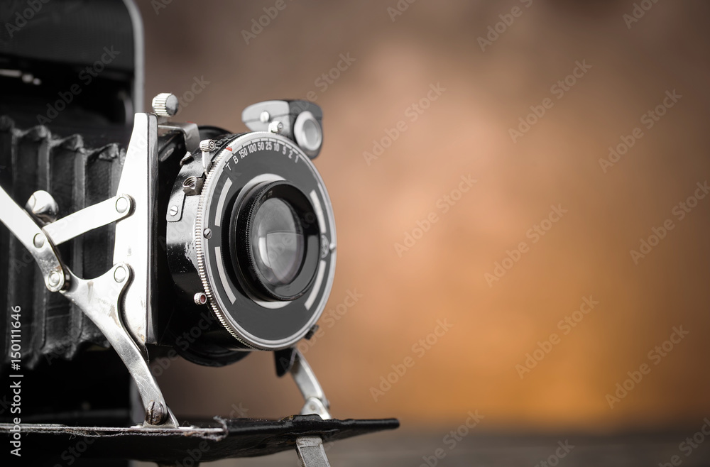 Old camera on an old background on a close-up table Stock Photo | Adobe ...