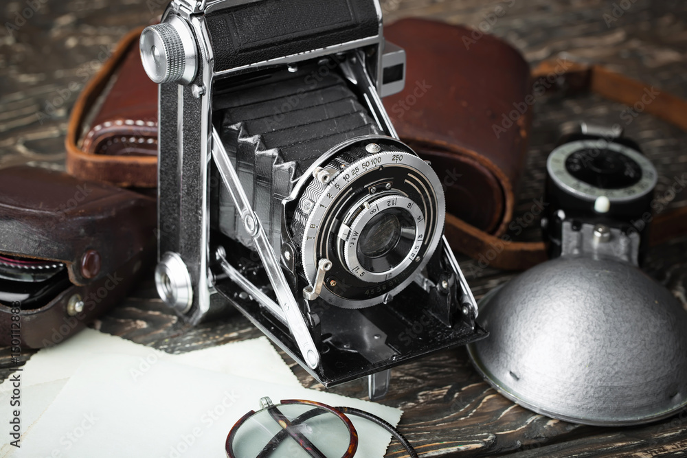 Old camera on an old background on a close-up table Stock Photo | Adobe ...