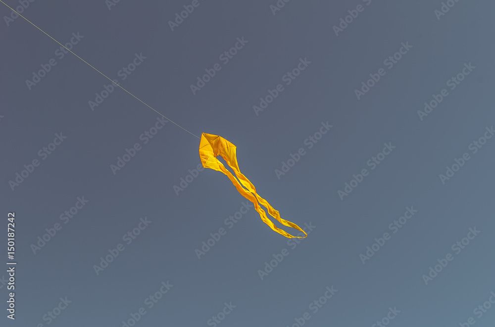 Colorful sky kites waving in the air. Kites billowing gliding flying ...