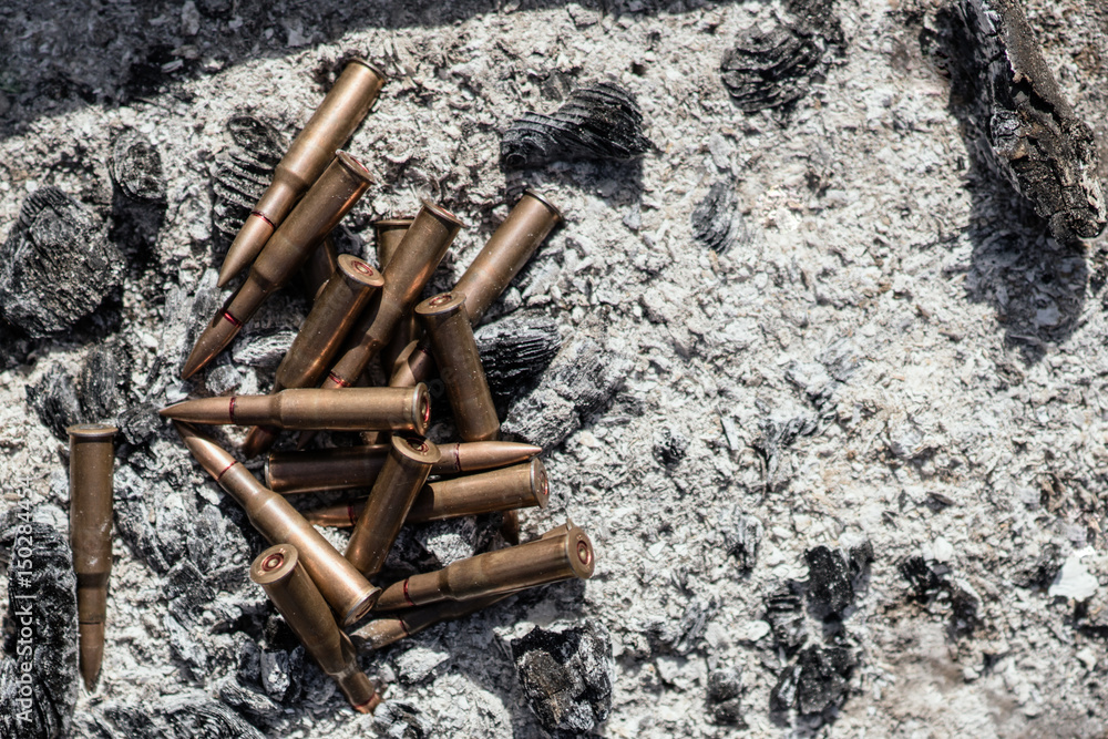 Bullets from AK Kalashnikov AK 47 in heat and coal. Concepts of war ...