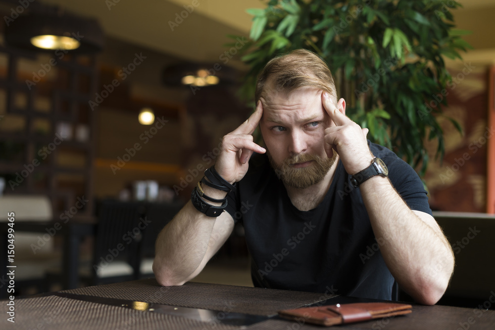 Successful intelligent business man relaxing in a luxury restaurant ...
